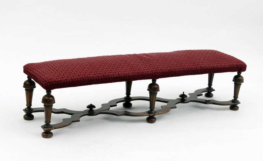 Lot 26 - A long stool with turned legs and wavy