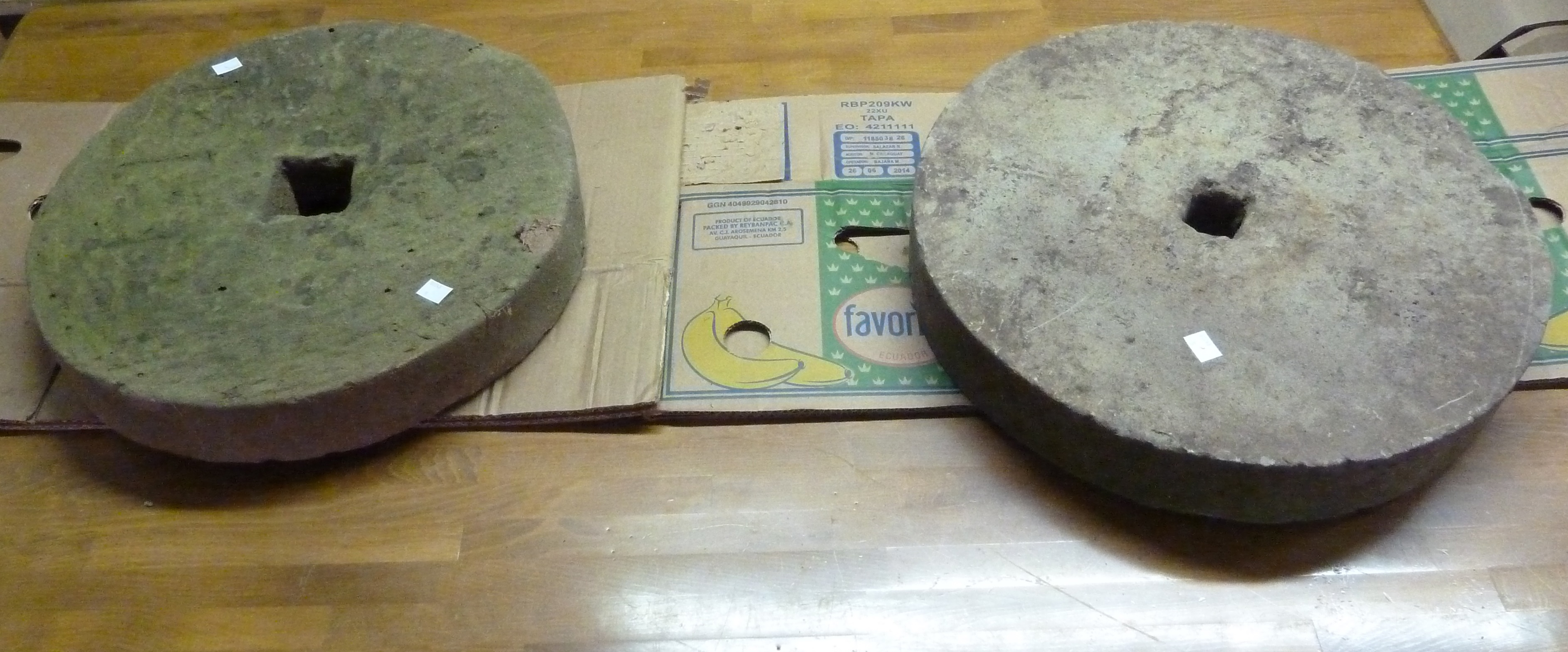 Lot 8 - Two circular grind stones and three capping