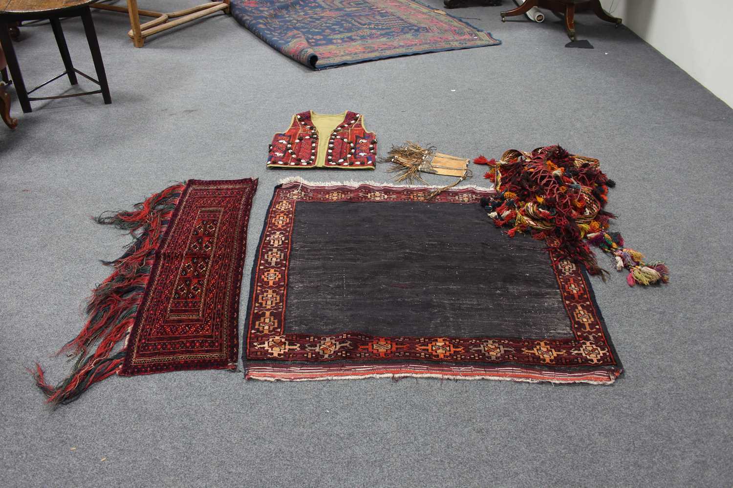 Lot 23 - A Middle Eastern rug, 127cm x 104cm, a saddle