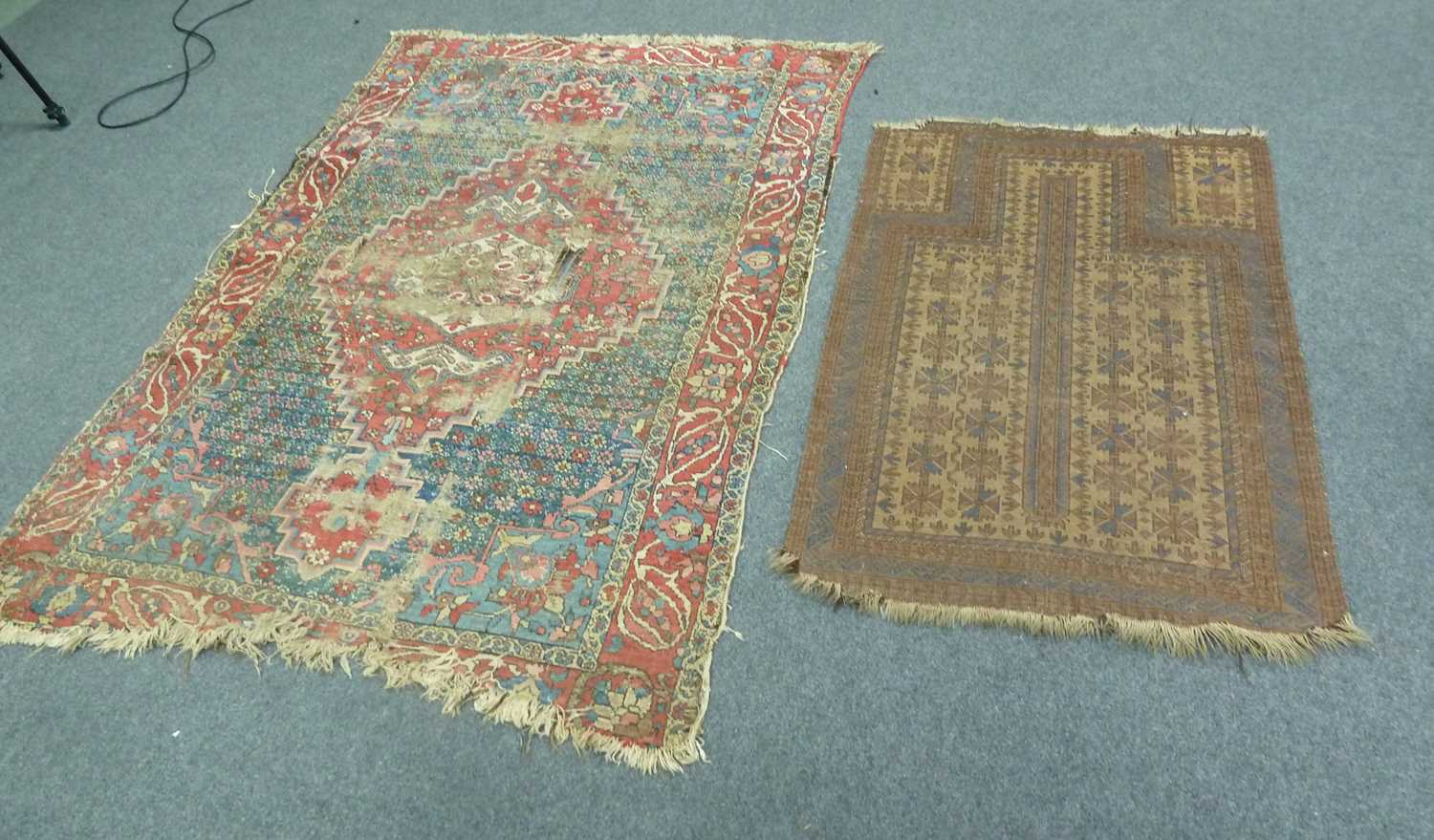 Lot 27 - Two Eastern rugs, both worn