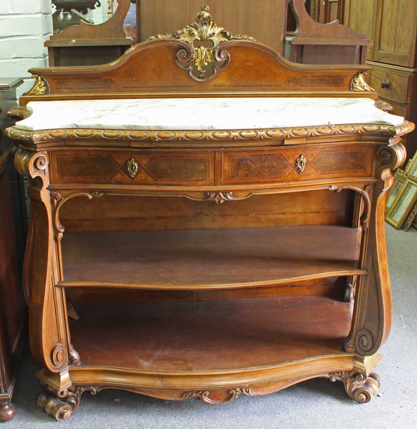 Lot 220 - A walnut buffet with carved back and border