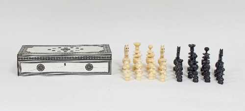 Lot 82 - An ivory chess set in a damascene box, the