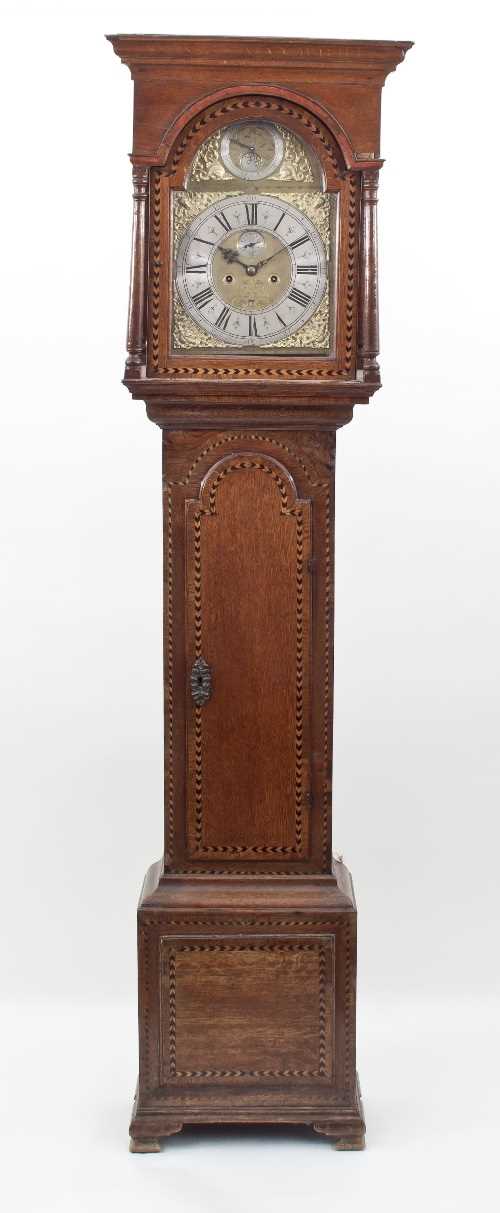 Lot 97 - A longcase clock, the arched brass dial