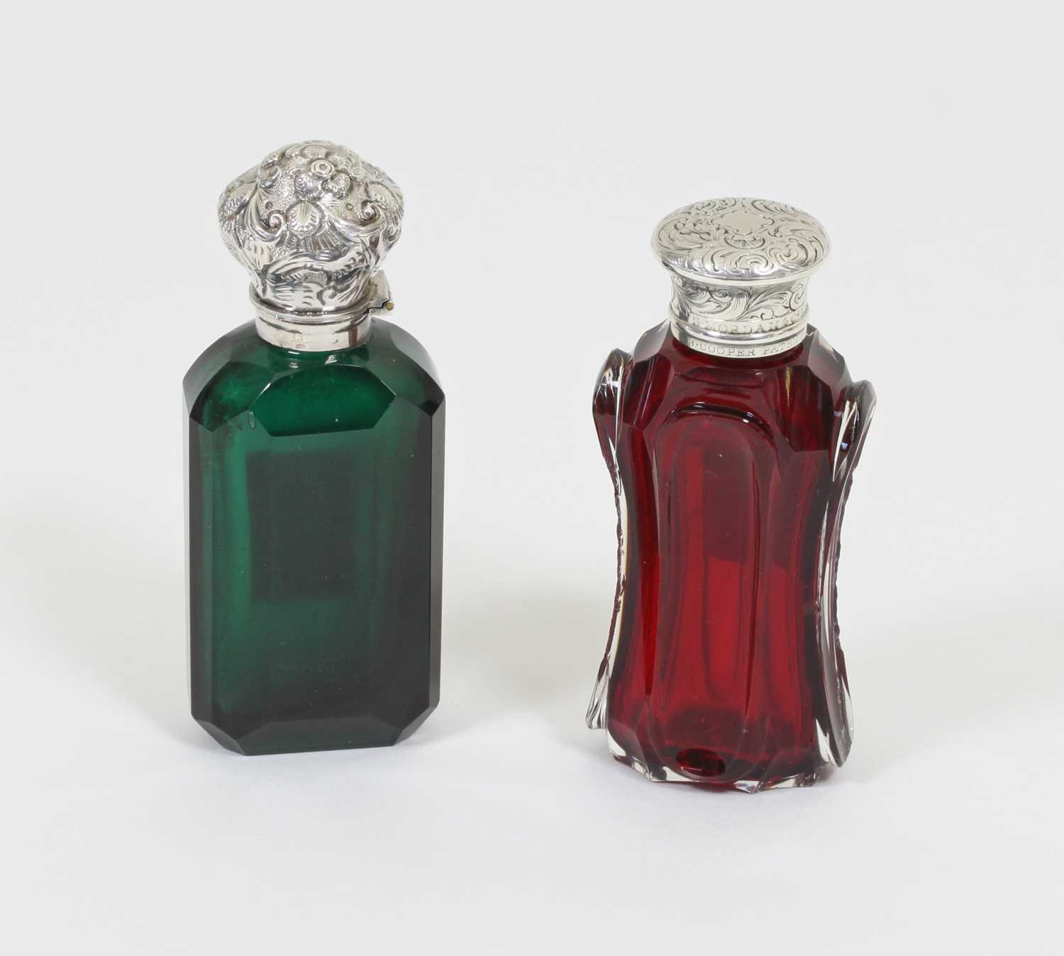 Lot 23 - A green glass scent bottle with scroll