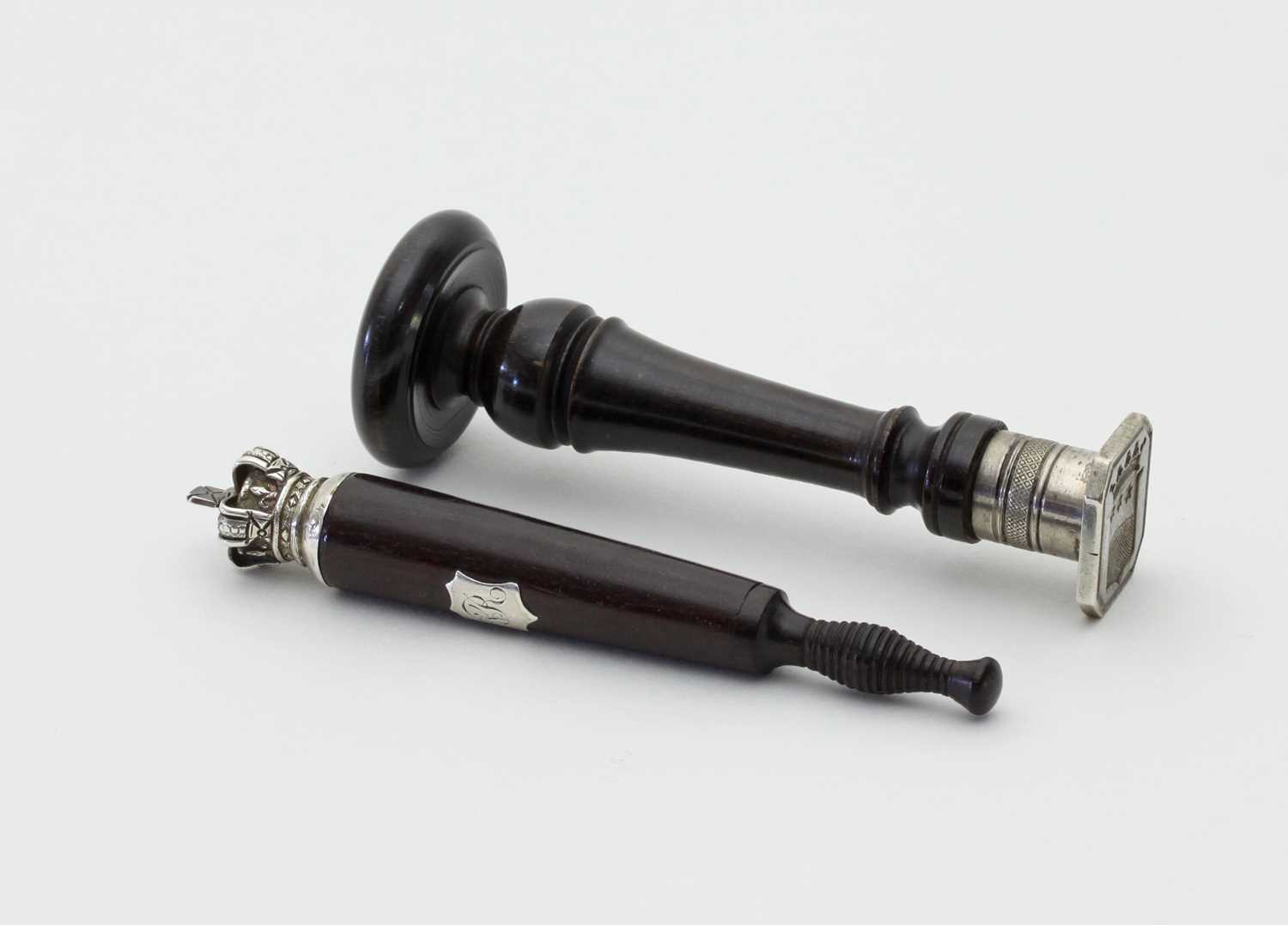 Lot 39 - A miniature ebonised tipstaff with open crown