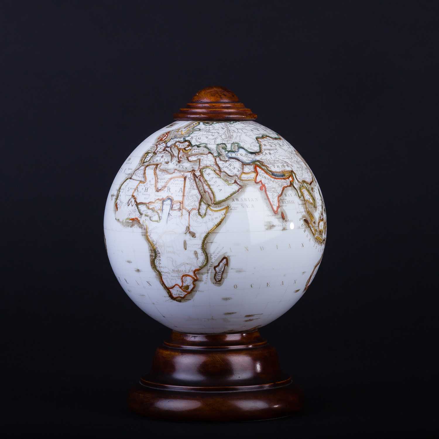 Lot 293 - An opaque white glass world globe, the