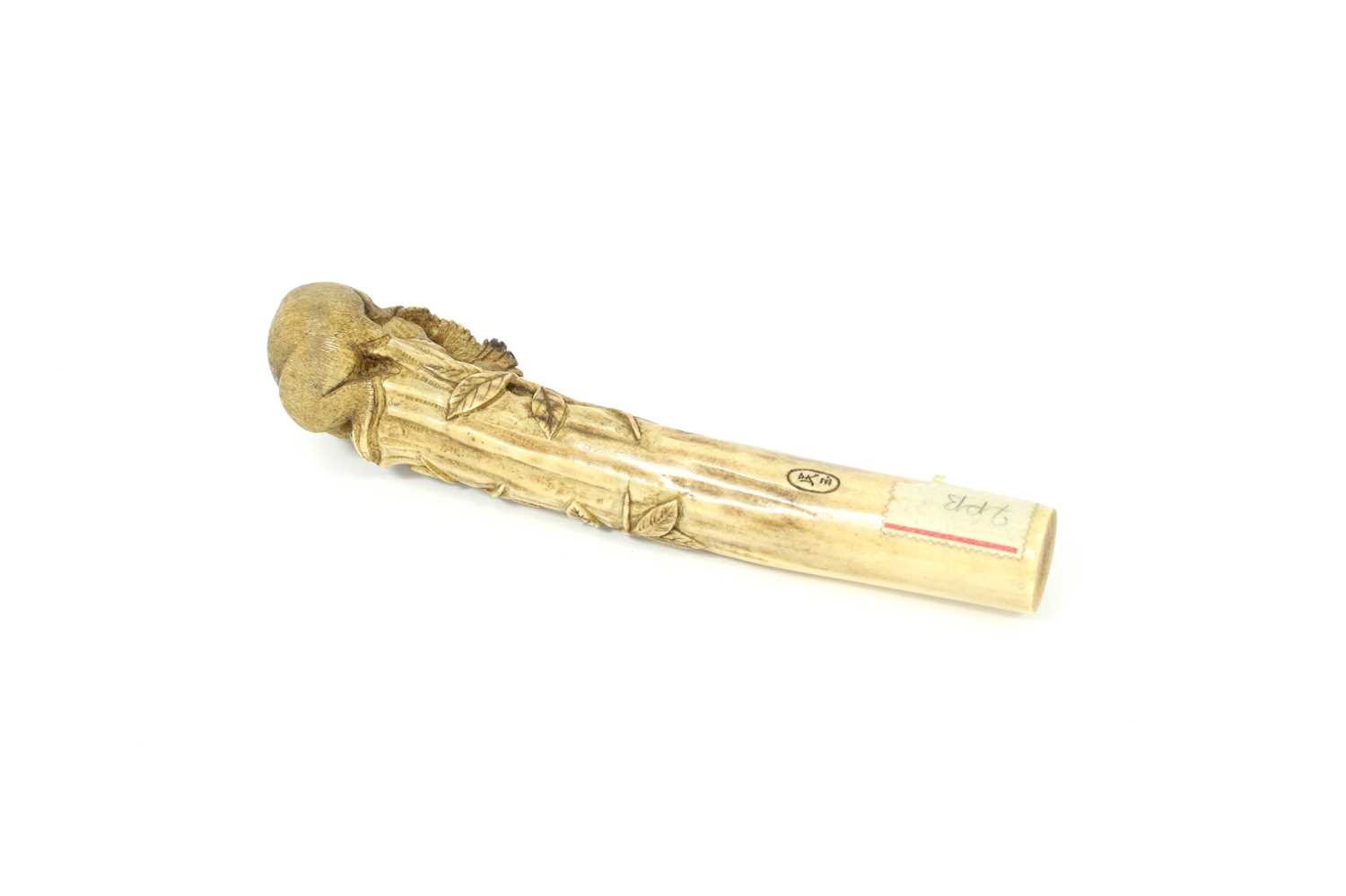Lot 189 - A Japanese carved bone parasol handle, circa