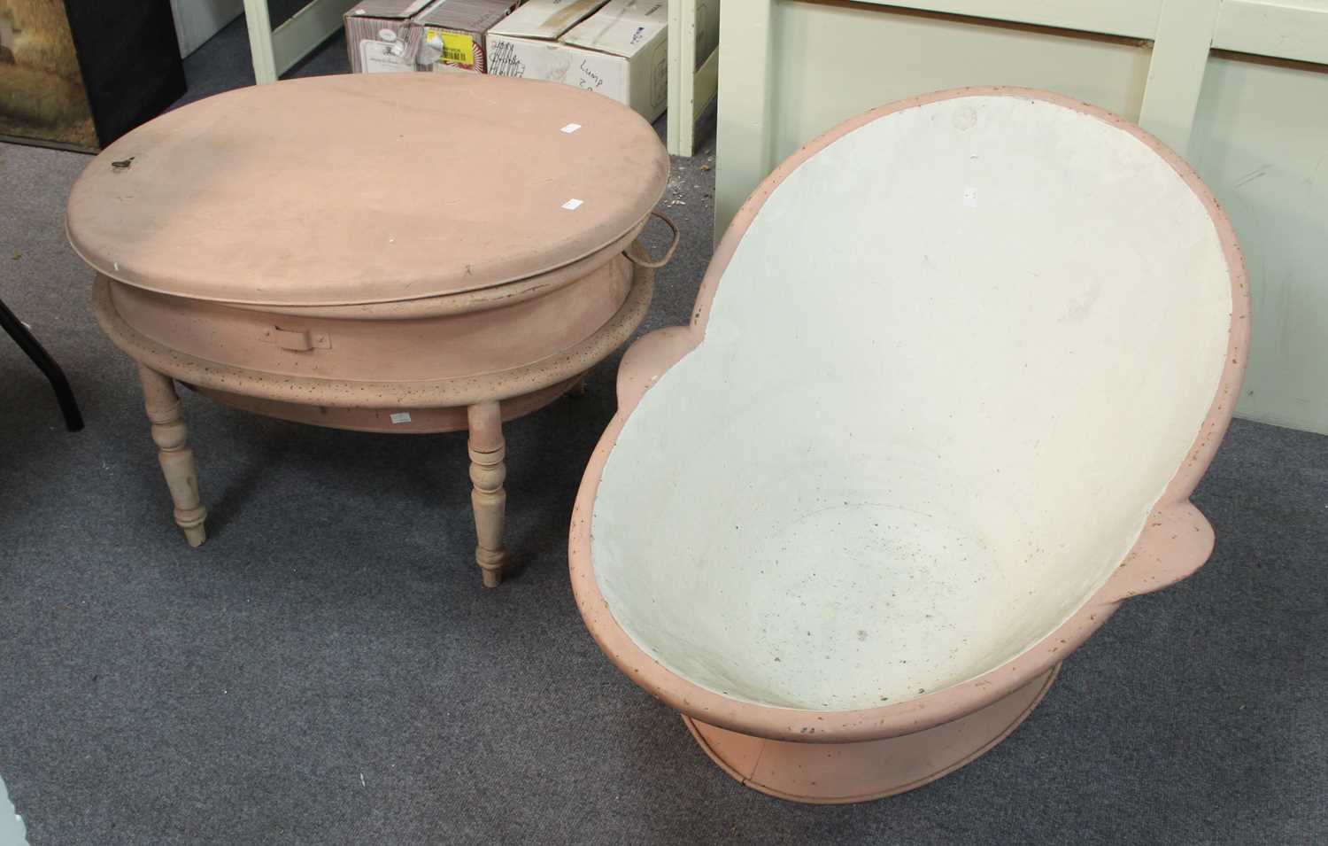 Lot 406 - An oval tin bath with lockable cover on a