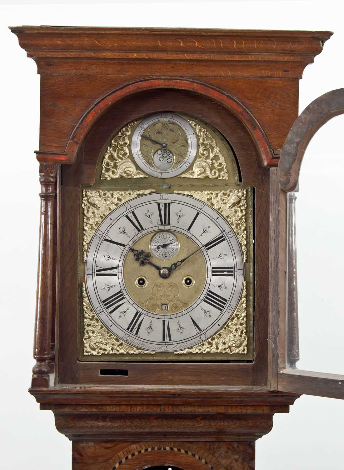 Lot 418 - A longcase clock, the arched brass dial