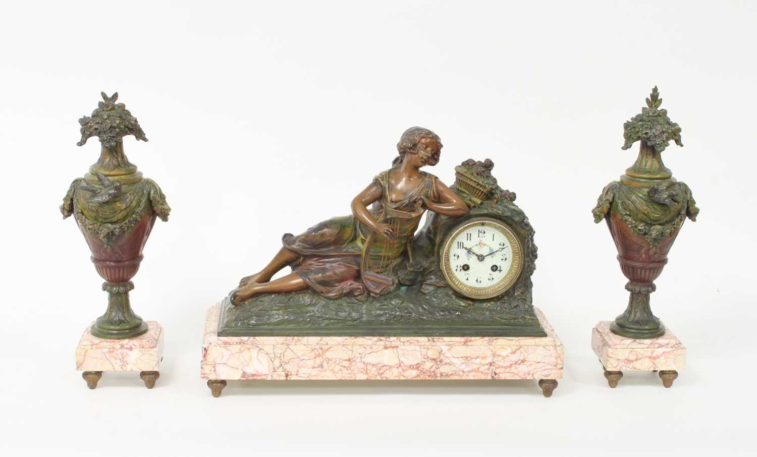 Lot 447 - A painted spelter clock set, the clock