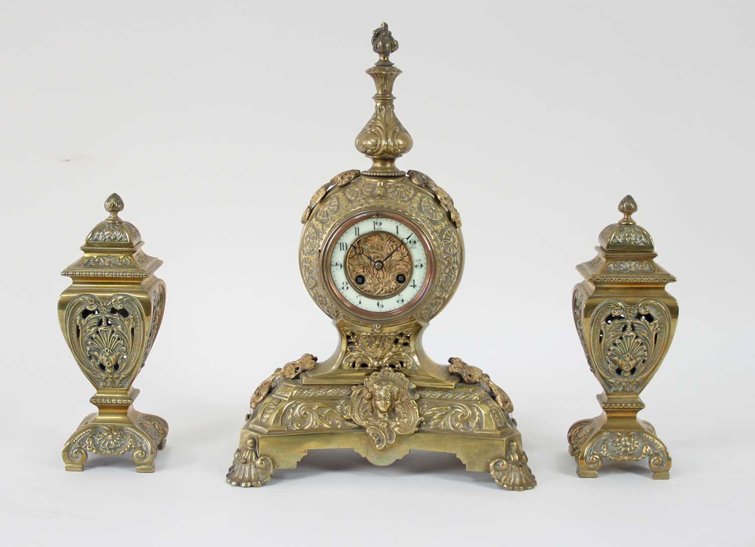 Lot 223 - A French brass mantel clock and urn