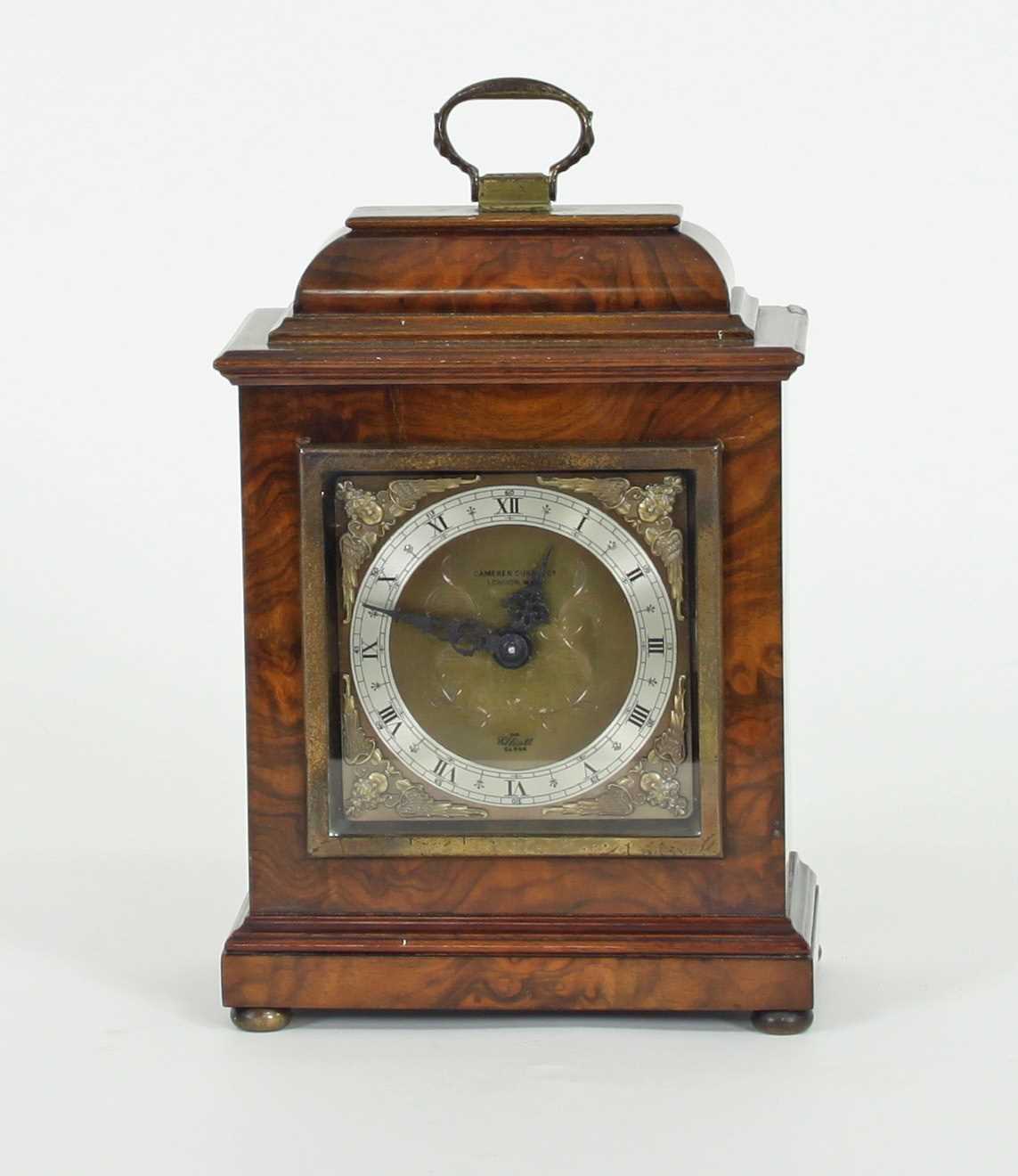 Lot 231 - An Elliot walnut cased mantel clock,