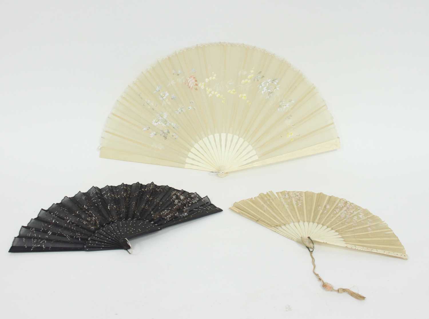 Lot 296 - Three carved bone fans, the largest example
