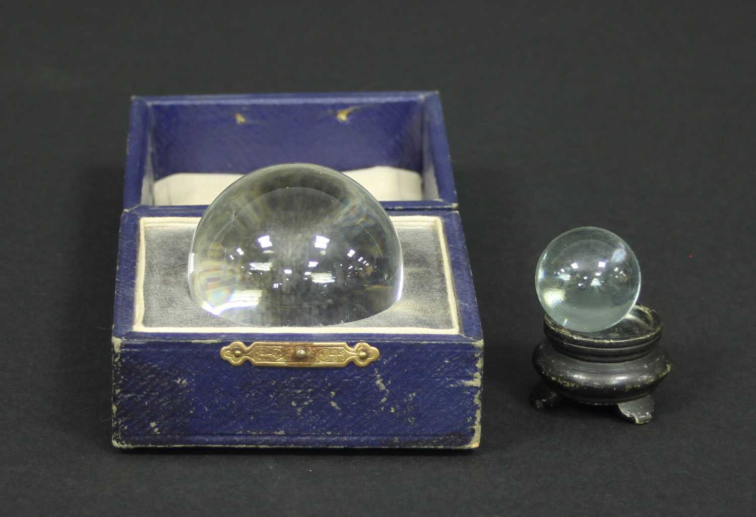 Lot 315 - A crystal ball, 5cm diameter in a box by Two