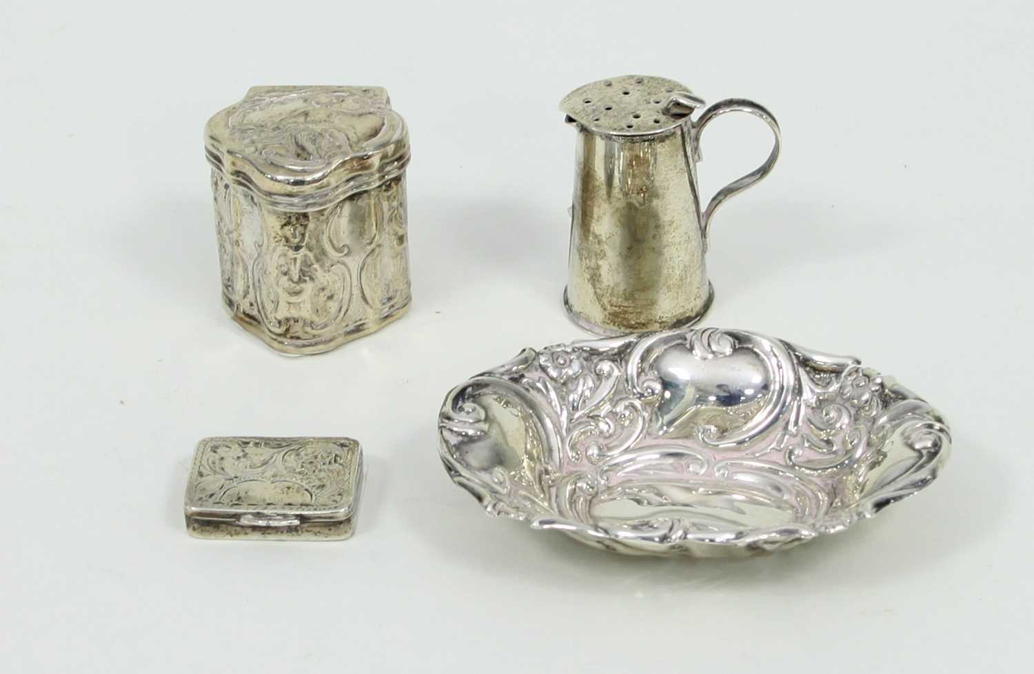 Lot 506 - A silver miniature jug with pierced cover,