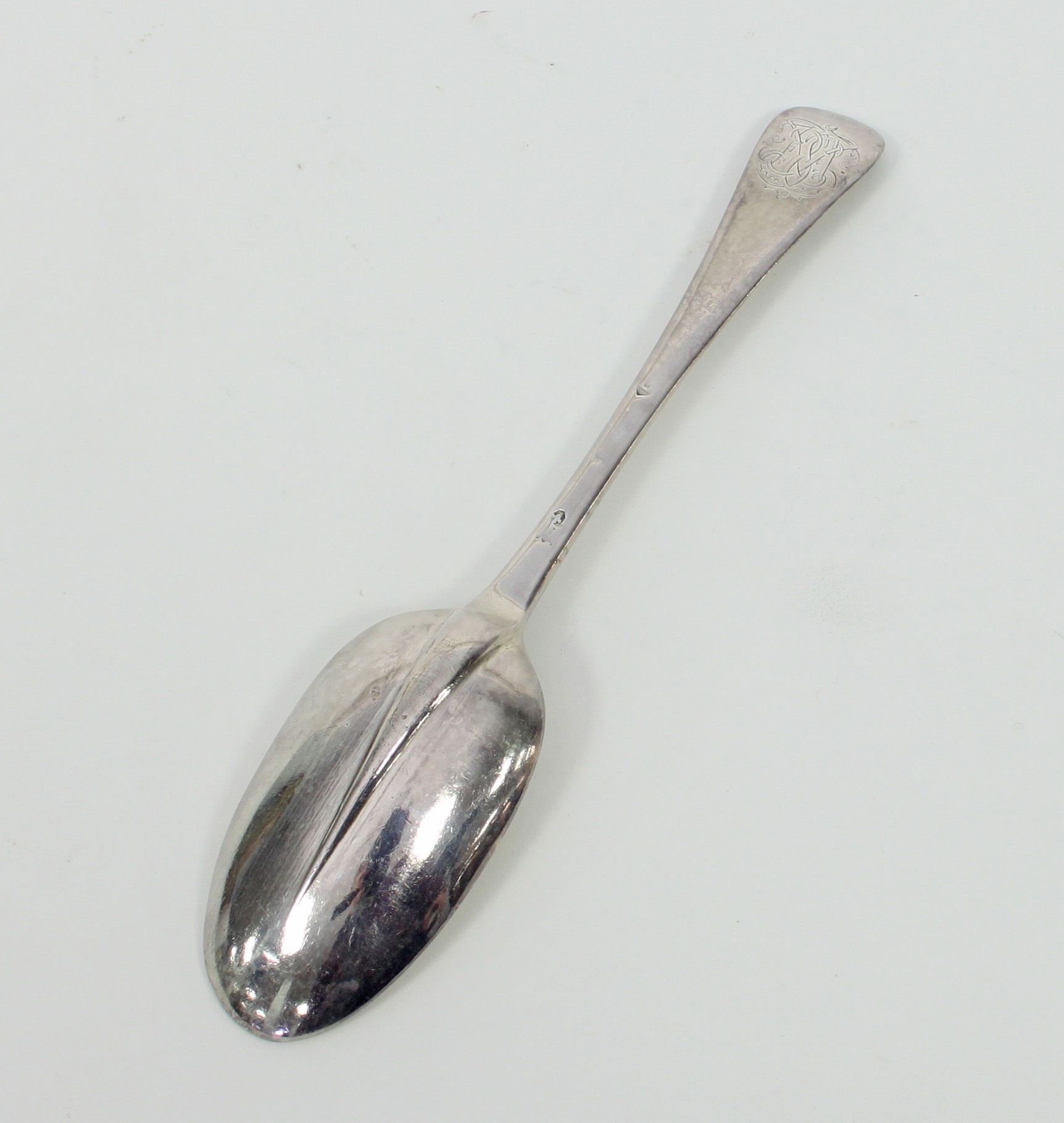 Lot 557 - An 18th Century silver rat tail spoon,