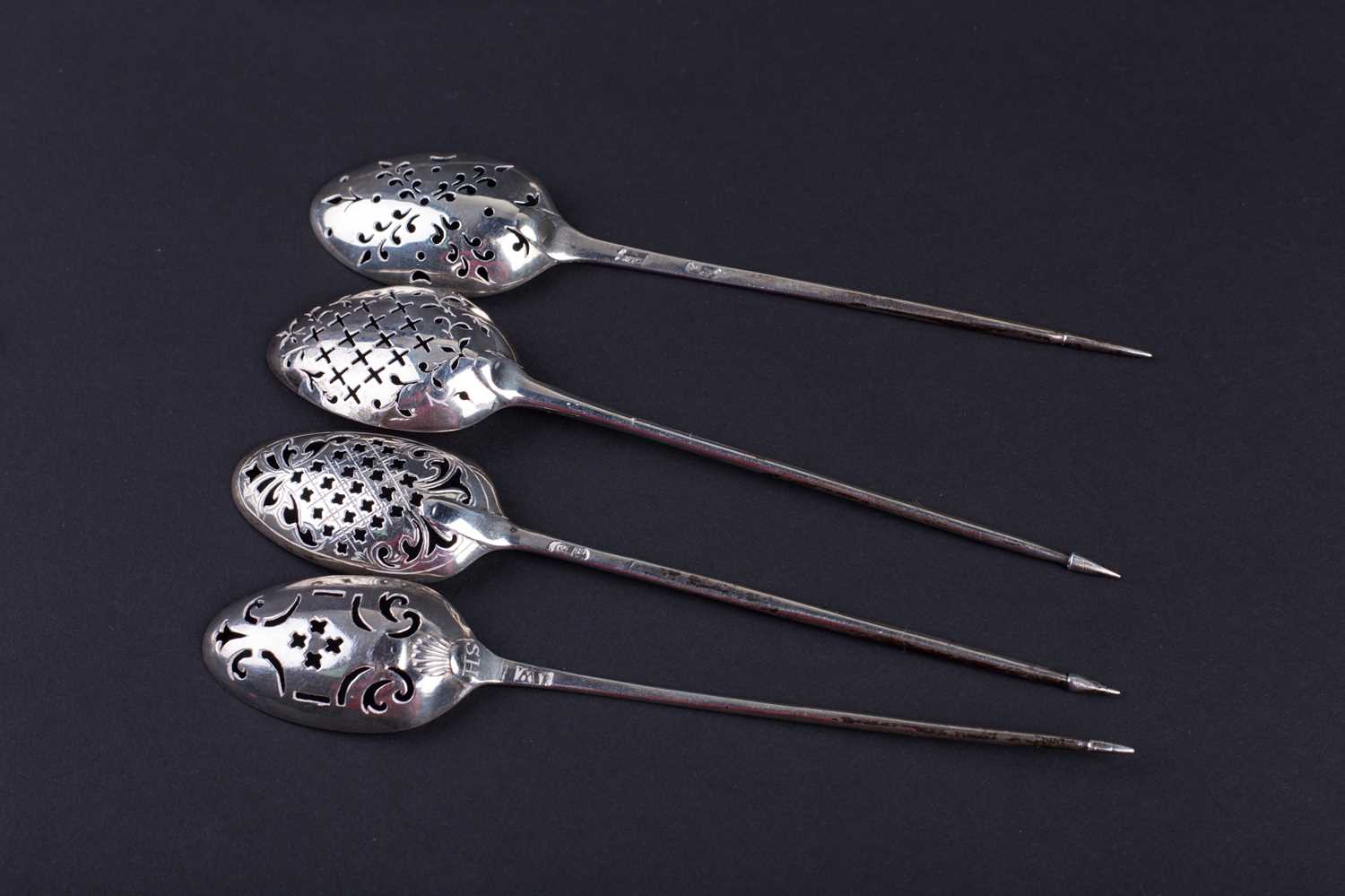 Lot 597 - Four early 18th Century silver mote spoons,
