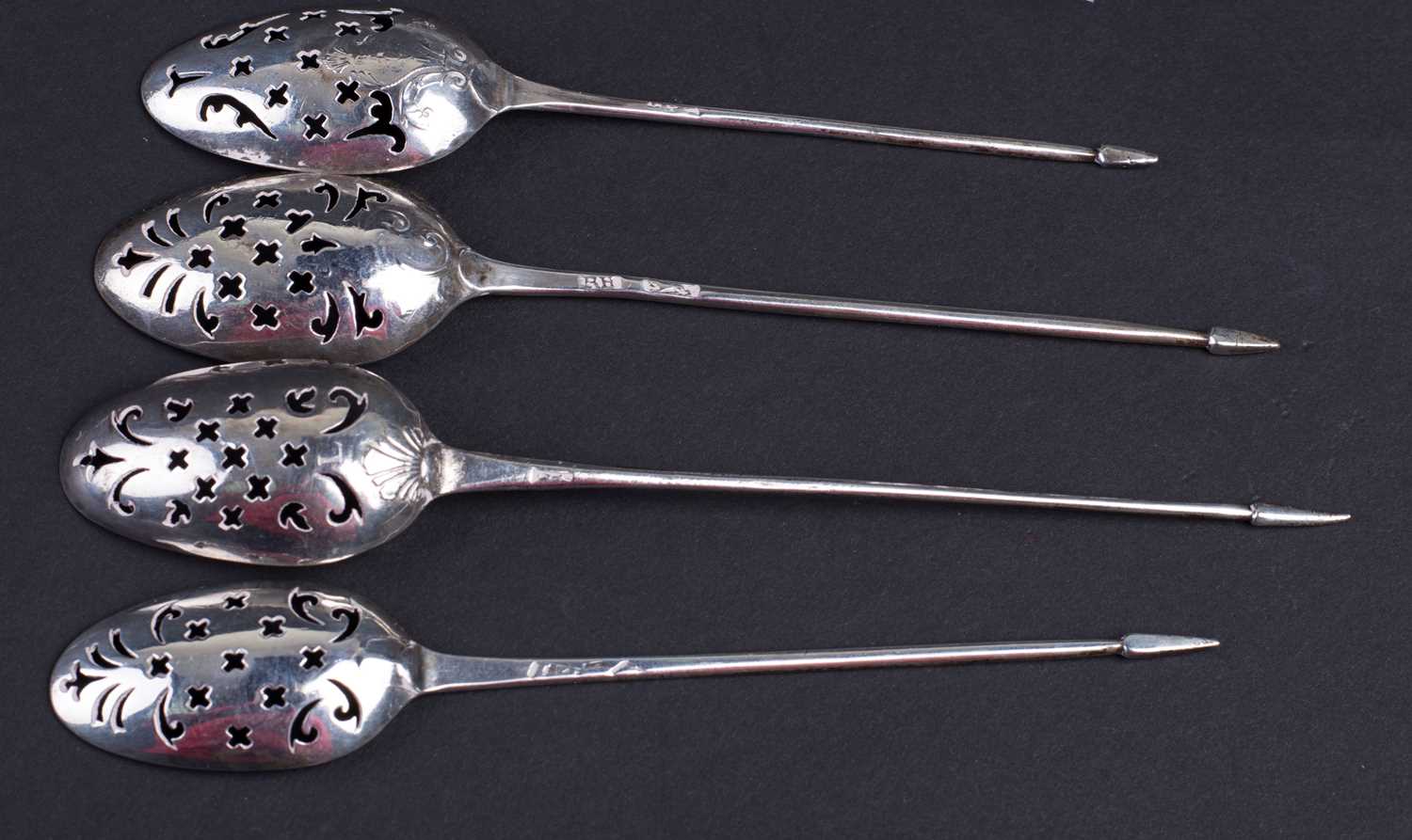 Lot 598 - An early 18th Century silver mote spoon,
