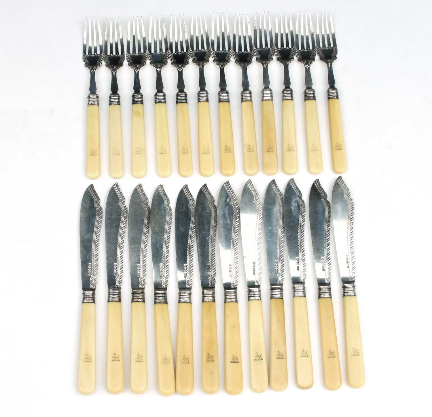 Lot 45 - A set of twelve silver fish knives and forks,