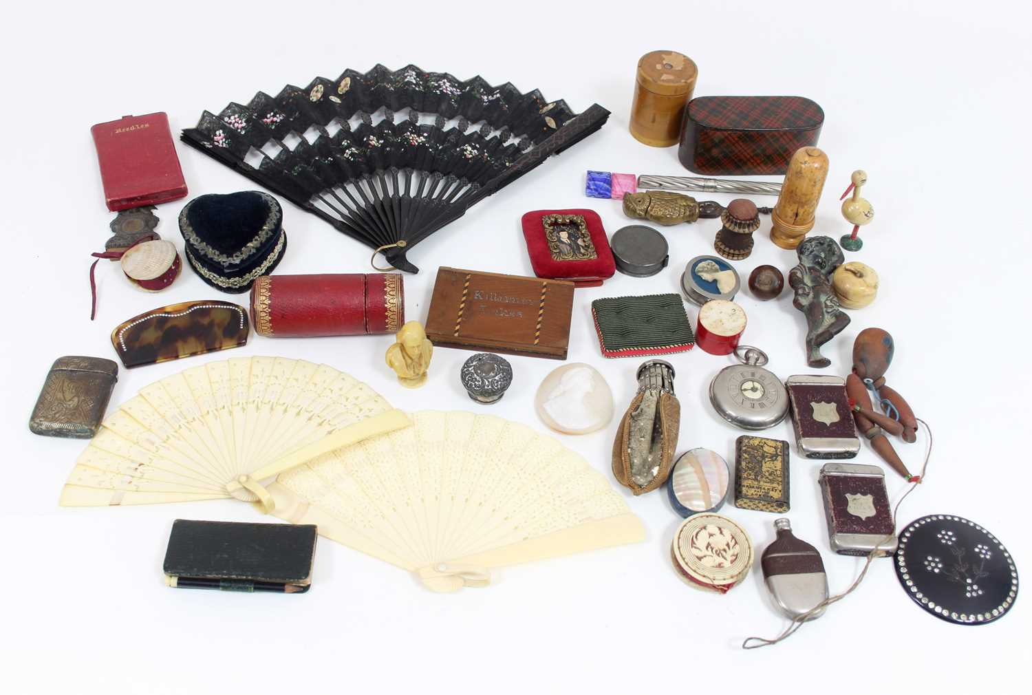 Lot 67 - A carved ivory pin holder, together with a