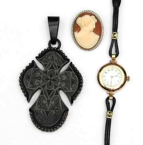 Lot 148 - A French jet crucifix pendant, carved with