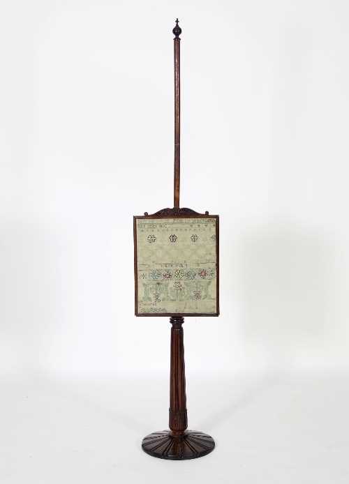 Lot 466 - A William IV pole screen on carved column