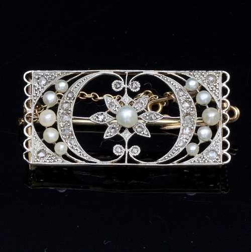 Lot 420 - A pearl and diamond rectangular panel brooch,