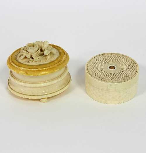 Lot 257 - A circular ivory box with spiral and plaited