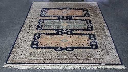 Lot 400 - A modern Eastern rug with three central