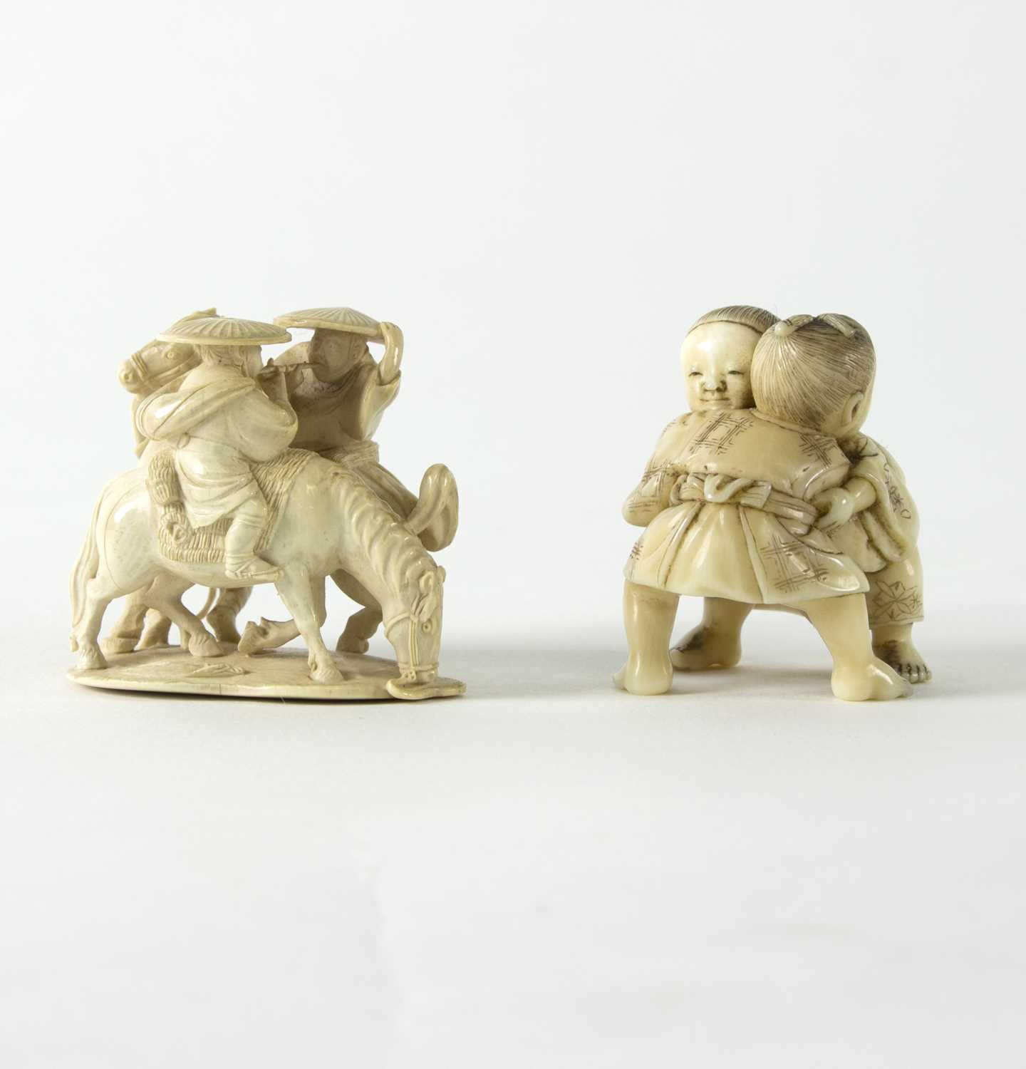 Lot 213 - A Japanese carved ivory netsuke, Meiji