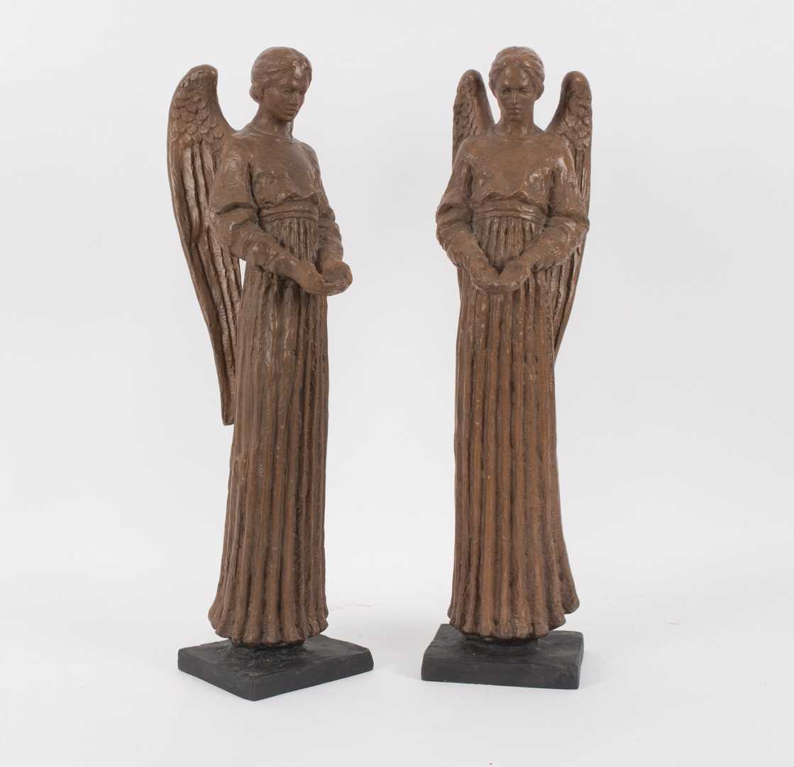 Lot 193 - A pair of terracotta welcoming angels, each