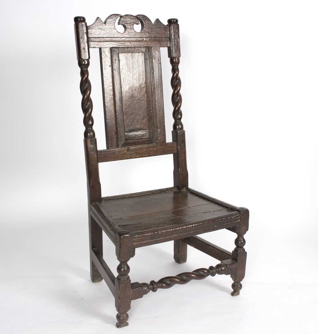 Lot 752 - A 17th Century oak panel back chair, with