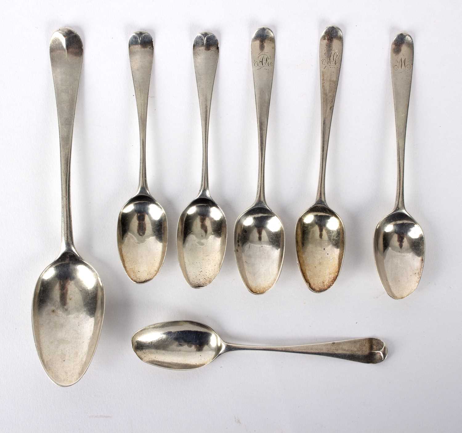Lot 111 - Three silver shell and scroll back teaspoons,