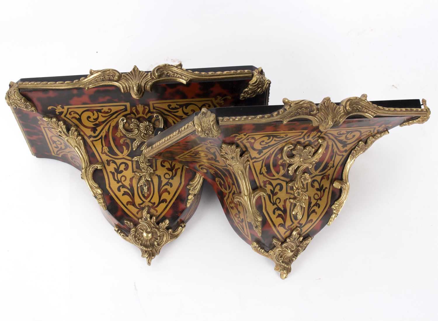 Lot 450 - A pair of Boulle style wall brackets,