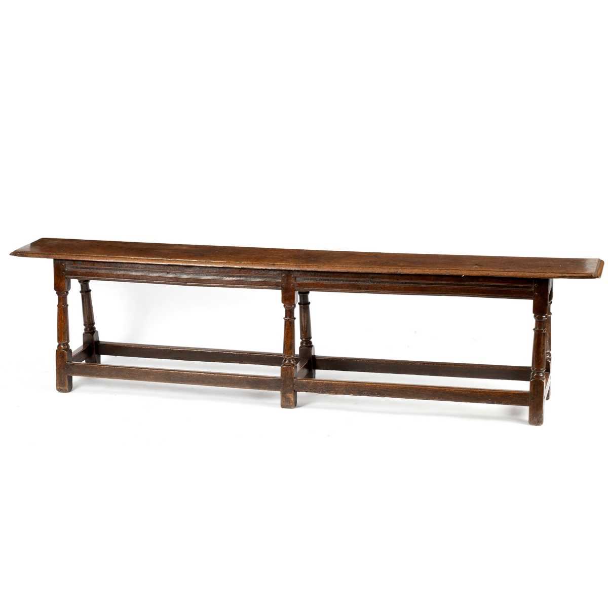 Lot 30 - An oak long bench, late 17th Century, the