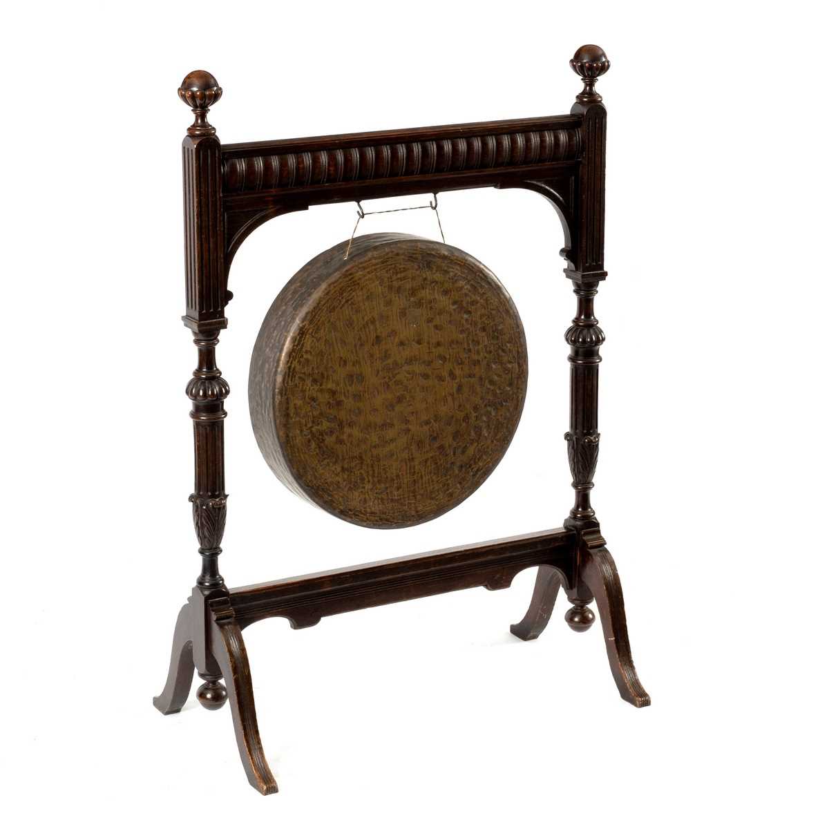 Lot 179 - A beaten brass gong on reeded column and