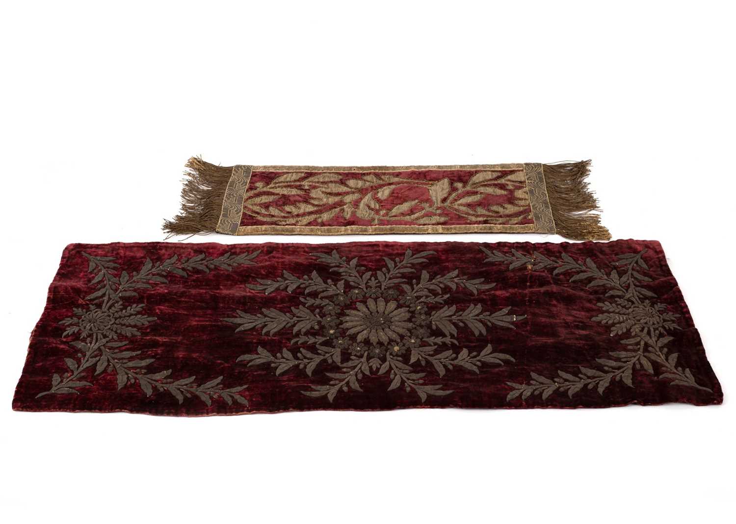 Lot 417 - A crimson ground table runner with wirework