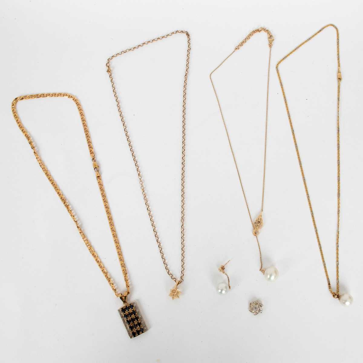 Lot 728 - A 9ct gold diamond and gem set pendant of