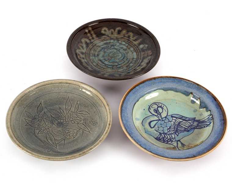 Lot 292 - Three 20th Century stoneware chargers; one