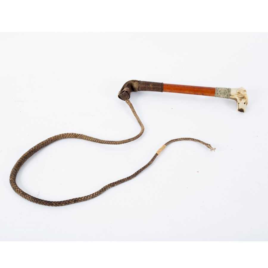 Lot 970 - A beagling whip, the carved bone handle of