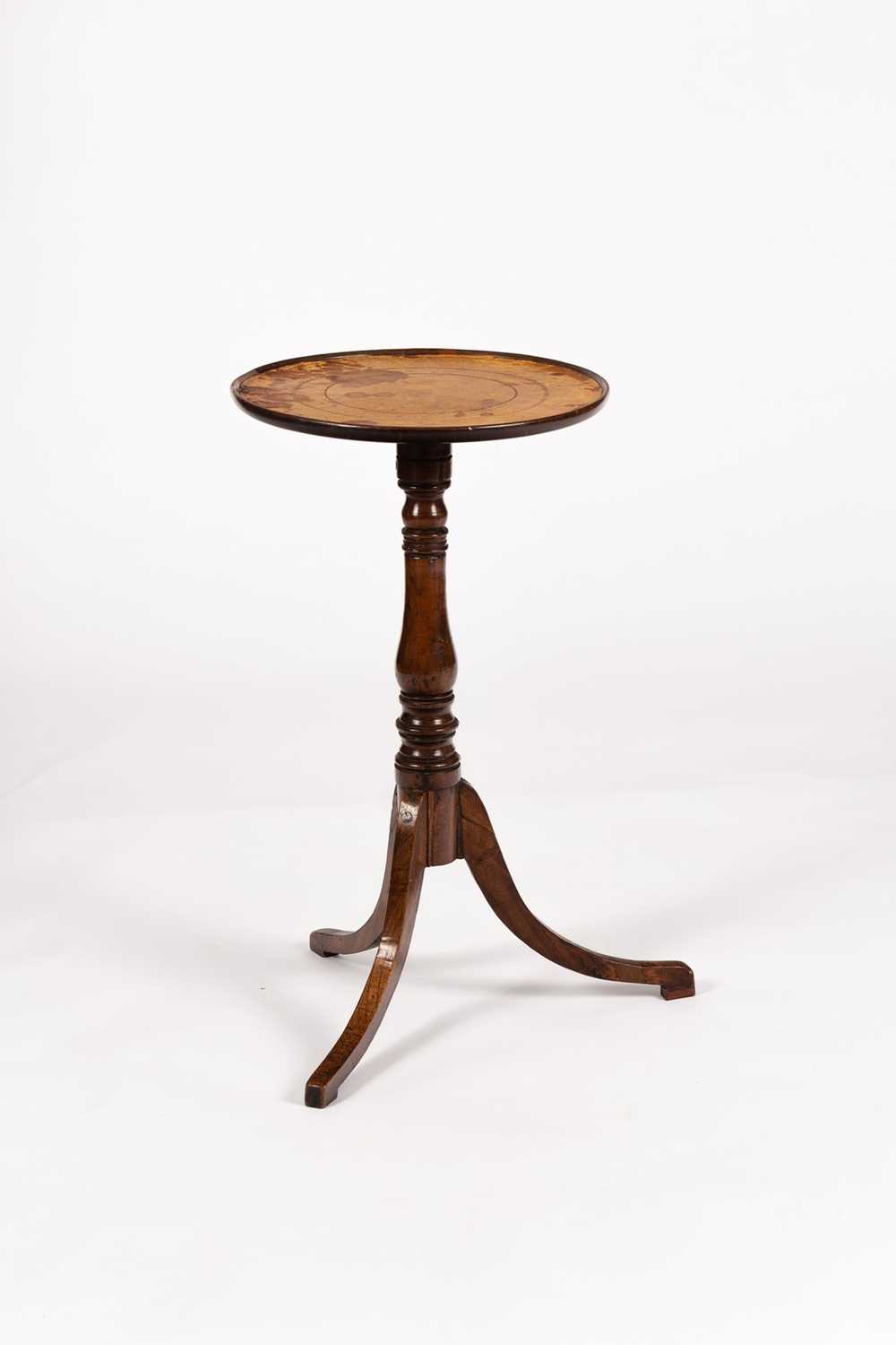 Lot 244 - A small circular table with a leather lined