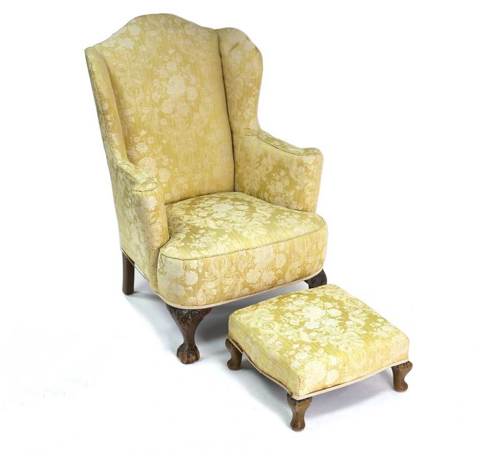 Lot 599 - A small Queen Anne style wingback armchair