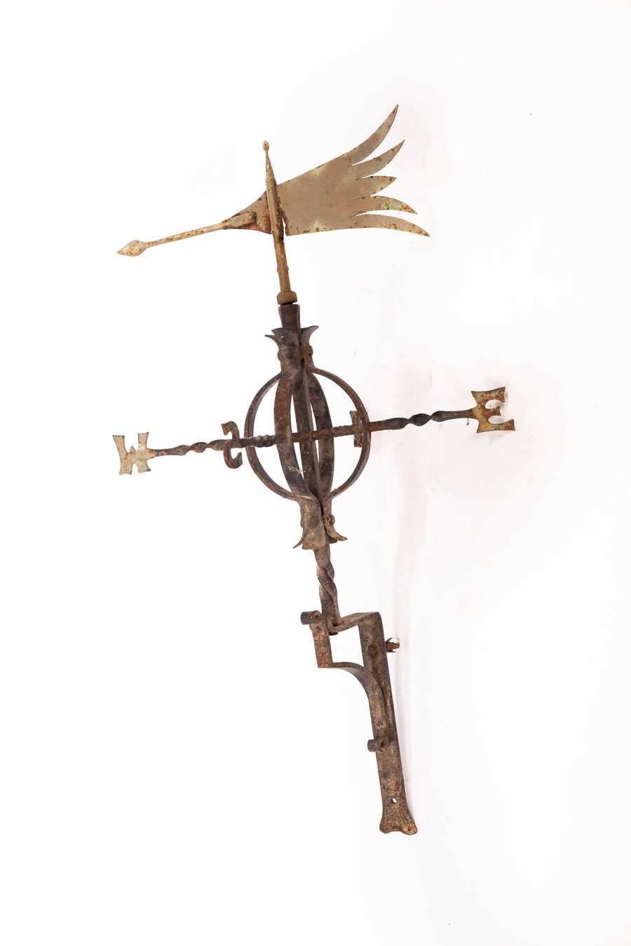 Lot 604 - A four point wrought iron weather vane and