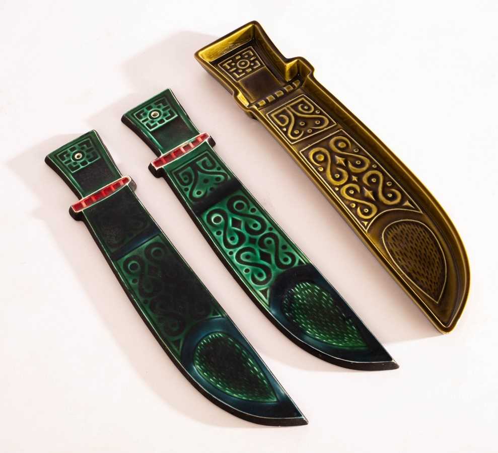 Lot 450 - Poole Pottery, two dagger form wall plaques