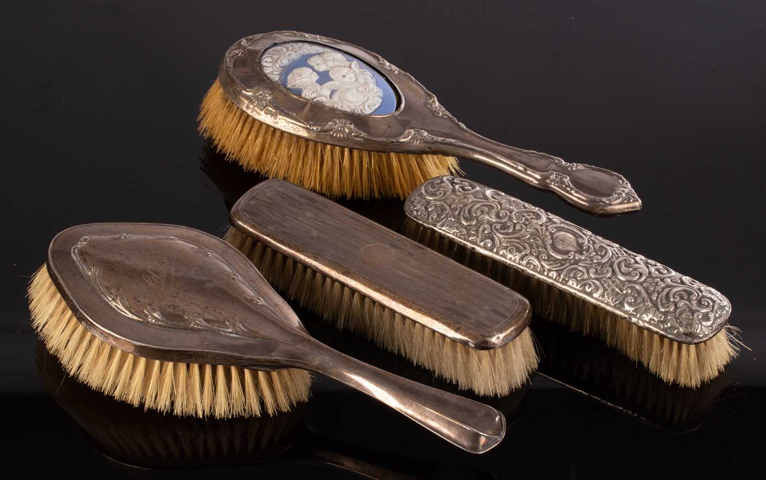 Lot 10 - A silver mounted dressing brush with a