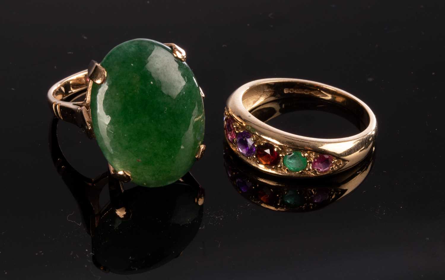 Lot 204 - A multi-gem set six-stone ring, circa 1988,