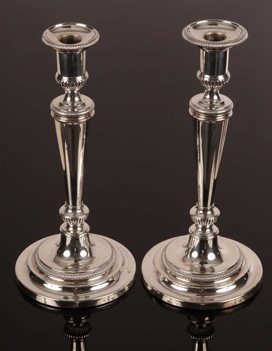 Lot 67 - A pair of George III silver candlesticks,
