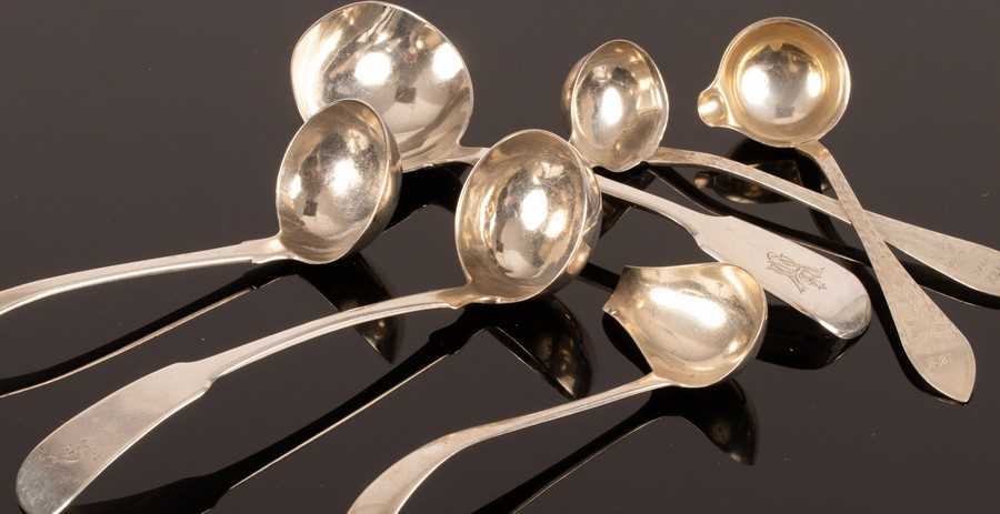 Lot 140 - A Scottish oar pattern silver toddy ladle,