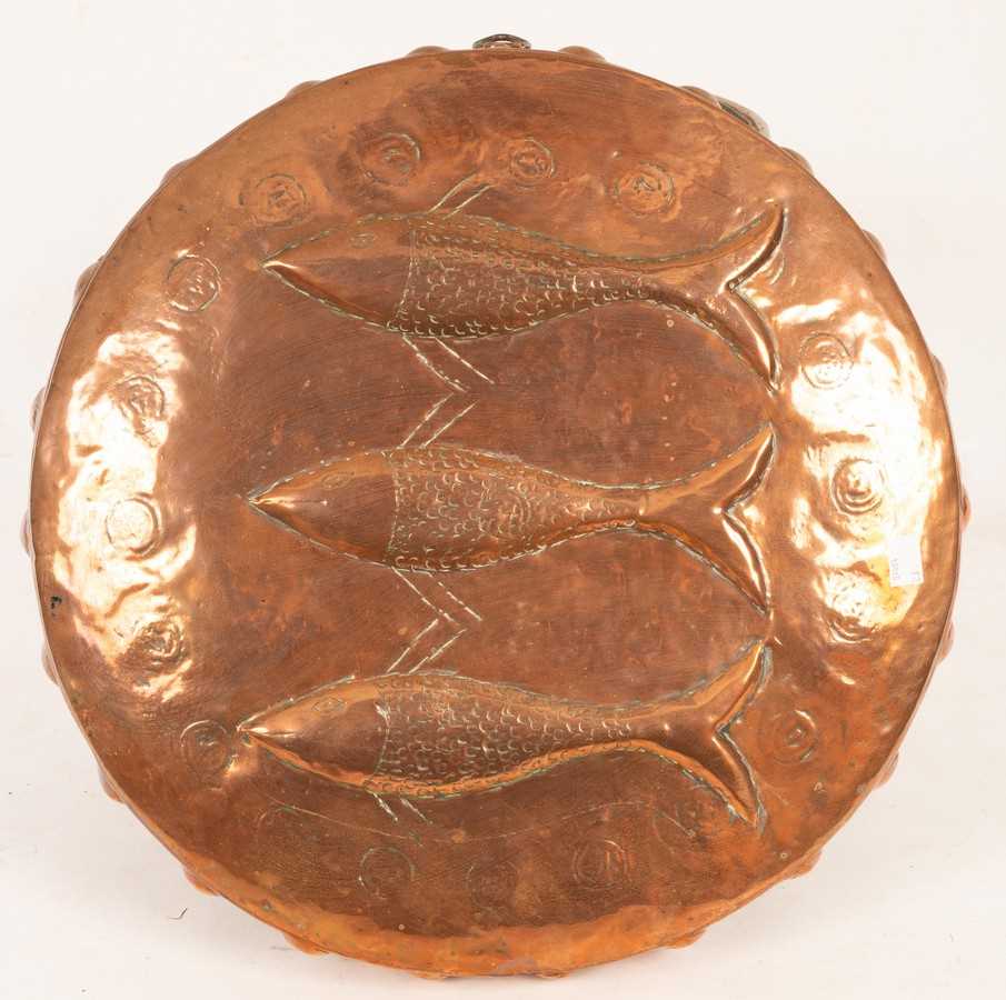 Lot 400 - A Newlyn School copper shield embossed three