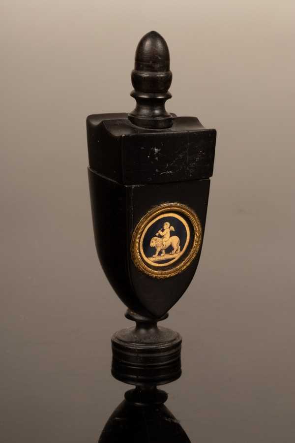 Lot 387 - An ebony thimble box of Classical urn-shape